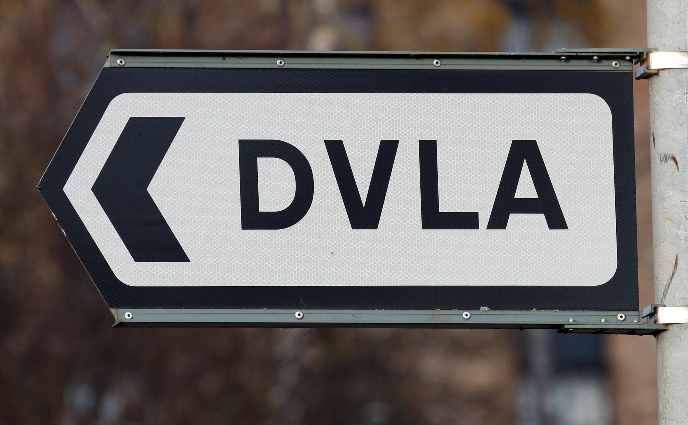 Police launch manhunt after yobs in balaclavas set fire to DVLA vehicle ...