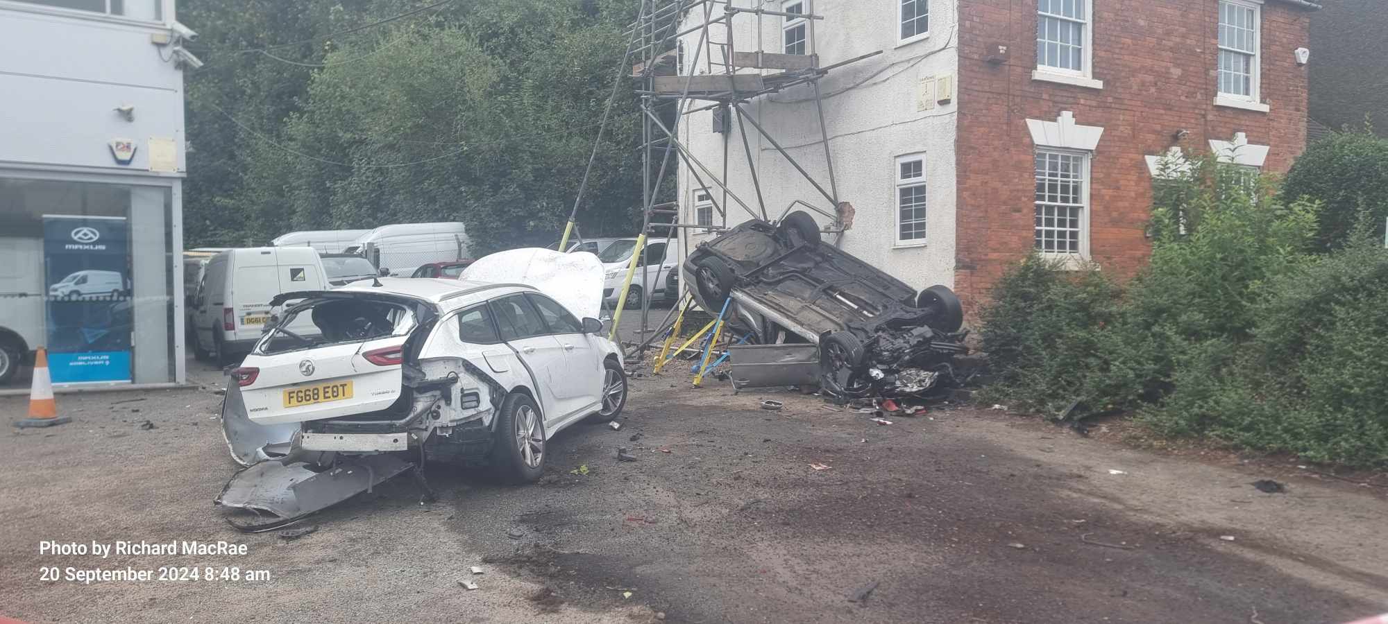 Driver hospitalised after horror dealership crash which left vehicle on ...